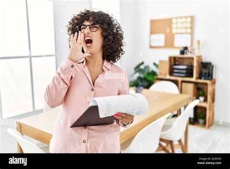 Young Middle Eastern Woman Wearing Business Style At Office Shouting