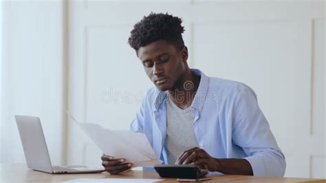 Young African Man Calculating Costs And Income At Home Office Stock Video Video Of Accounting