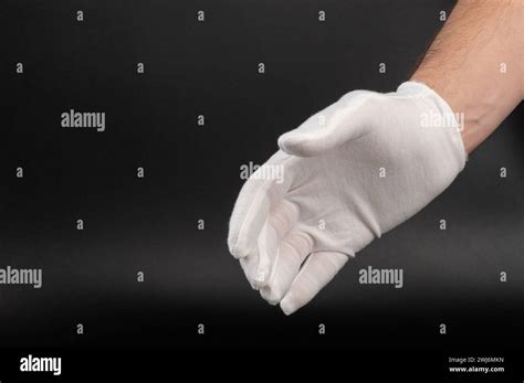 Hand In White Glove Handshake Pose Isolated On Black Background Stock