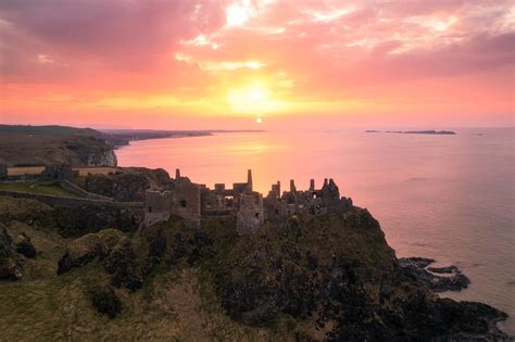 Sunset Over Dunluce Castle Northern Ireland 🌅 Rcastles