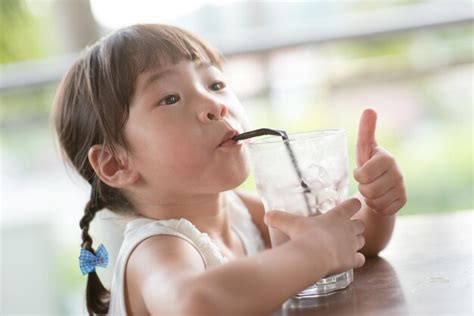 Premium Photo Cute Girl Drinking While Gesturing Thumbs Up