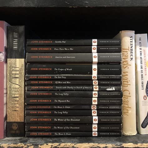 Macro Literature — A Stack Of Steinbeck Penguin Classics On A Dusty