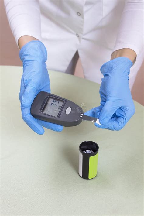 Measurement Of Sugar With A Glucometer The Woman`s Hand In Medical