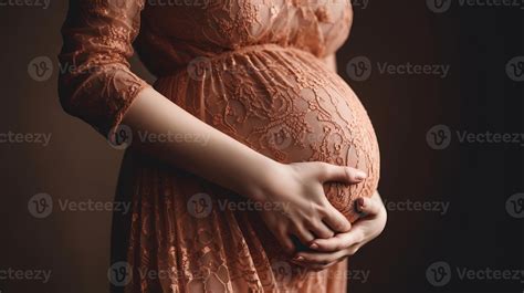 A Pregnant Lady Holds Her Hands On Her Stomach Close Up Center On Her