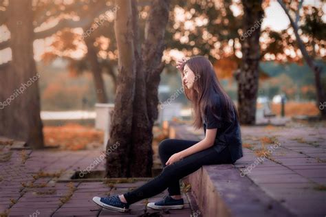 Girl Sitting Down Alone