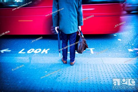 one unrecognizable executive crossing the street london england uk