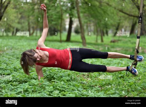 Beautiful Young Woman Doing Trx Exercise With Suspension Trainer Sling