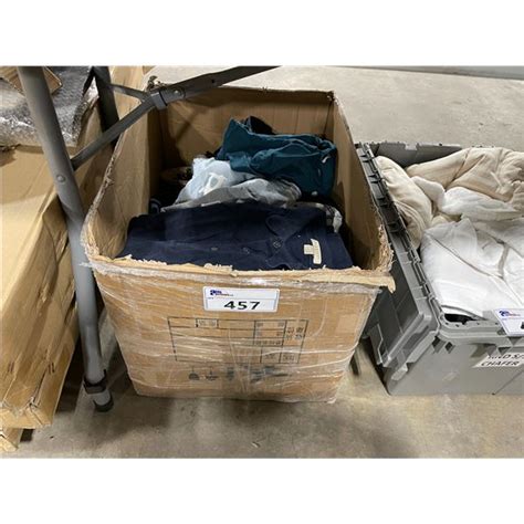 Box Of Assorted Imported Clothing Items Shoes And Books Pens