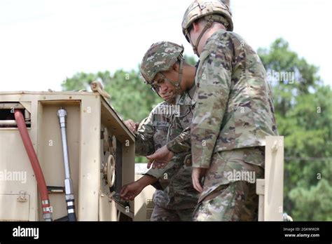 Staff Sgt Joey Yera Shows Spc Antonio Diez Deandino How To Operate