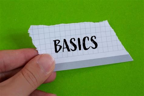 premium photo basics word written on ripped paper with green