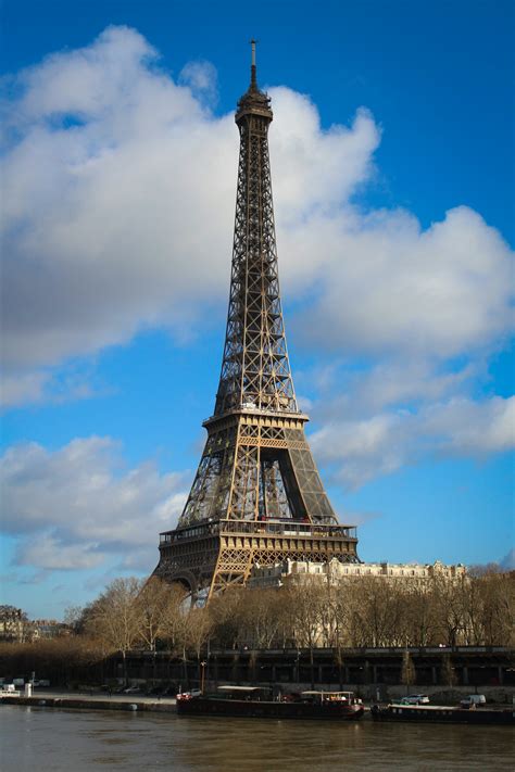 The Eiffel Tower Towering Over The City Of Paris Photo Free Eiffel