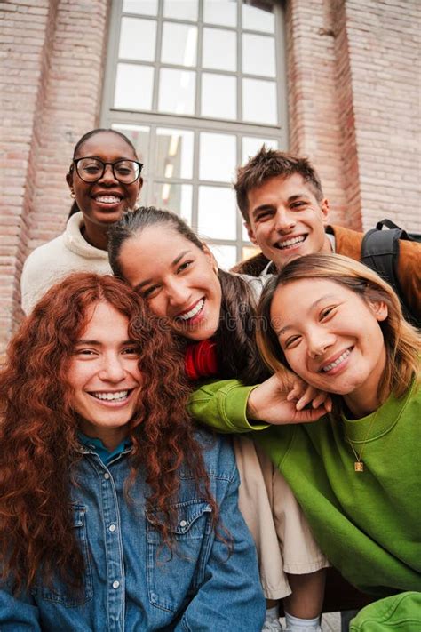 Vertical Portrait Of A Group Of Friends Having Fun And Smiling Together
