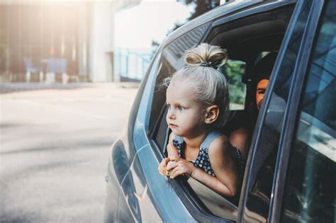 Premium Photo Cute Girl Looking Through Car Window