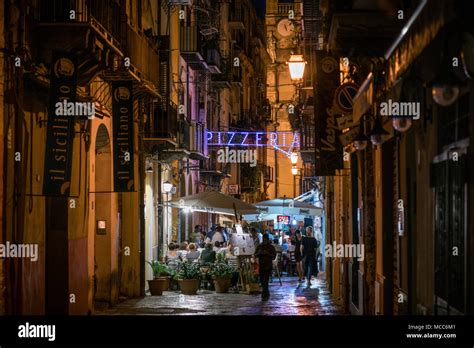 People Sat Outside Eating At A Pizzeria In Palermo Sicily Italy At