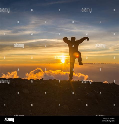 Man Jump Through The Gap On Sunset Fiery Background Element Of Design Stock Photo Alamy