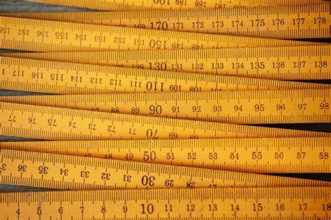 Traditional Yellow Wooden Folding Rule With Decimal Metric System Stock