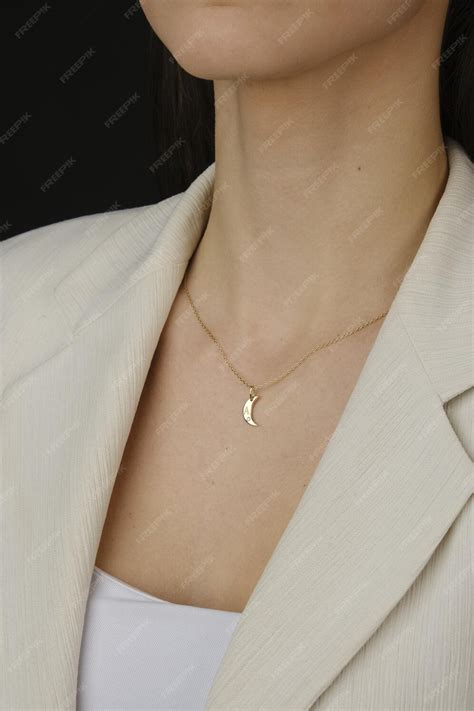 Premium Photo A Gold Leaf On The Arm Of A Woman