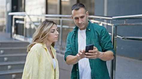 Man And Woman Couple Standing Together Using Smartphone At Street Stock Image Image Of Family