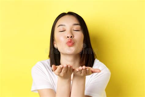 Valentines Day Concept Close Up Of Beautiful Asian Woman Pucker Lips And Holding Hands Near
