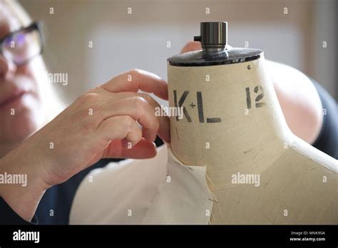 Pattern Maker Fashion A Real Pattern Maker Pattern Cutter At Work On A Calico Toile On A