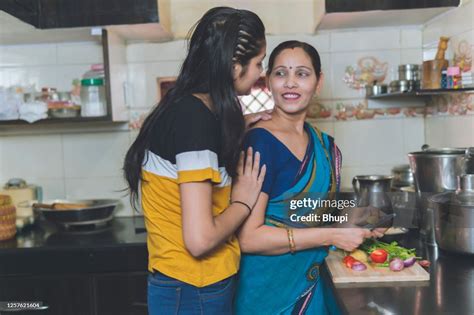 Indian Mother Is Teaching Her Daughter How To Chop Vegetable And
