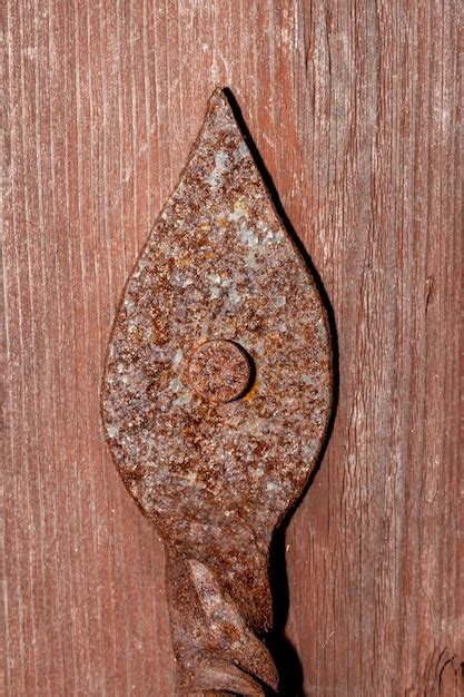 Premium Photo A Rusty Hook With A Hole In It