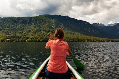 Premium Photo Girl Kayaking In The Bohinj Lake