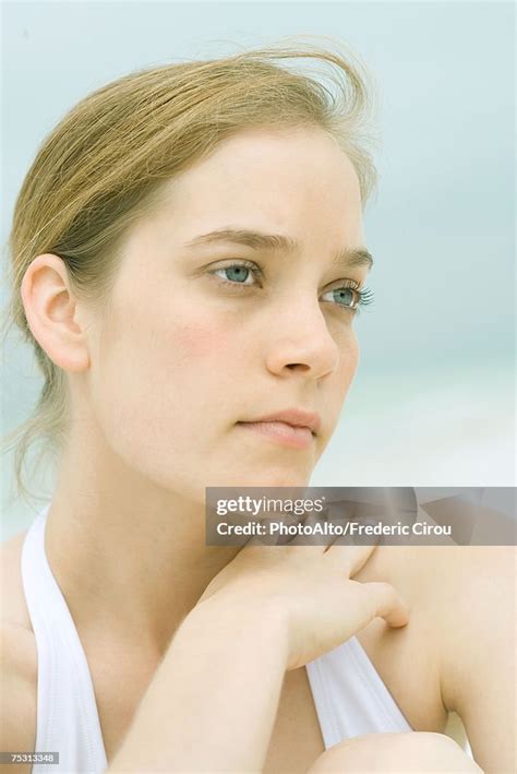 Young Woman Head And Shoulders Portrait Sea In Background High Res