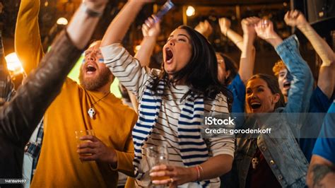 Soccer Club Members Cheering For Their Team Playing In An International Cup Final Supportive