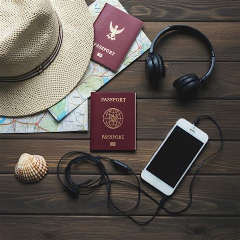 A Passport And A Hat Are On A Table With A Passport And A Hat Premium