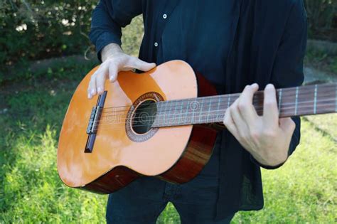 Start Learning Classical Guitar With The First Musical Chords Stock