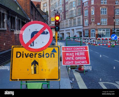 Diversion Sign And Temporary Traffic Light Westminster London Uk