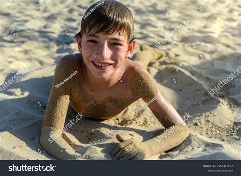 Preteen Smiles Lying On Beach Covered Stock Photo Shutterstock