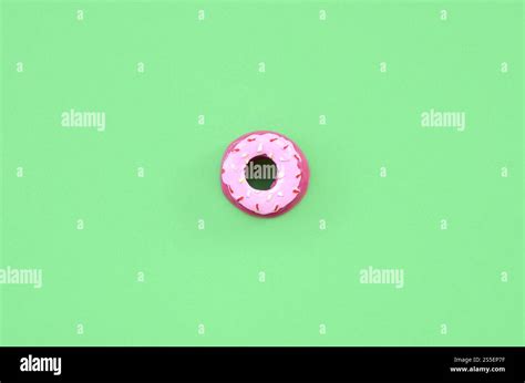 Single Small Plastic Donut Lies On A Pastel Colorful Background Flat Lay Minimal Composition