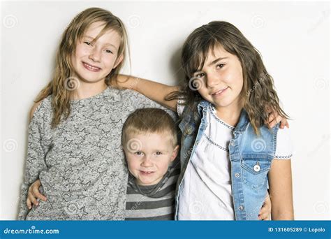 Sisters And Brother Using Tablet At Home Different Age Siblings
