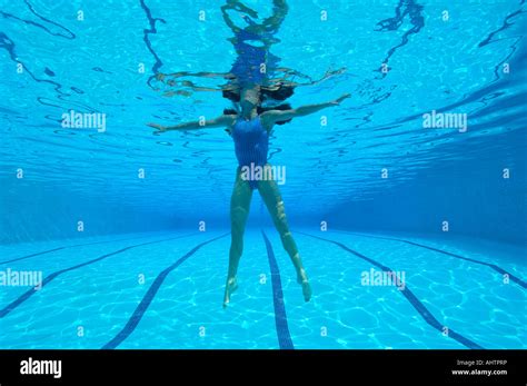 Women Swimming Underwater
