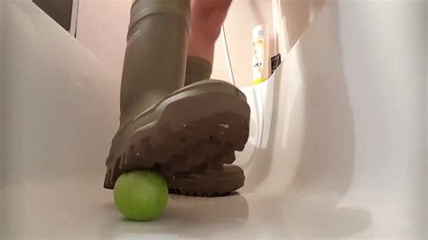 Giant Dunlop Boots Crushing A Bunch Of Fruit