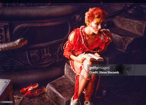 View Of An Unidentified Actor And Dancer As She Reads A Book On Set