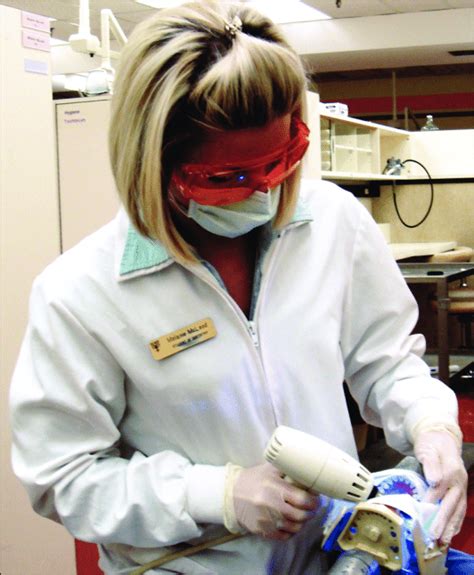 One Of The Authors Demonstrating Proper Light Curing Technique She Is