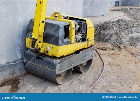 Manual Compact Asphalt Roller For Tamping Soil At A Construction Site