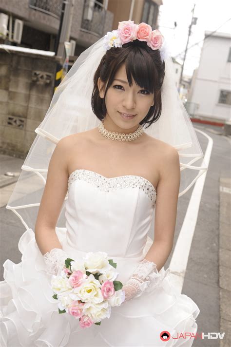 Beautiful Japanese Bride Ruri Narumiya Poses On The Street During Her