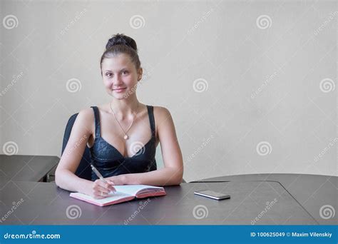 Beautiful And Very Secretary Working After Hours At Office And Smile