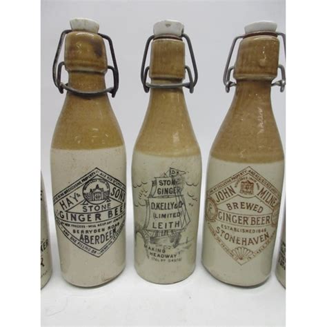 A Collection Of Fourteen Scottish Stoneware Ginger Beer And Stout