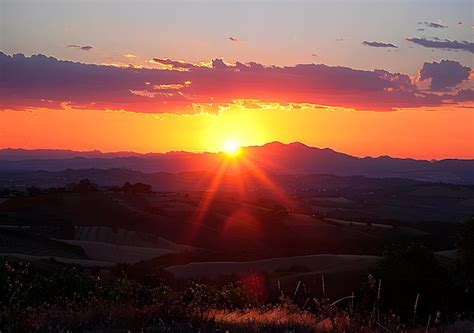 Sunset Over Rolling Hills Premium Ai Generated Image