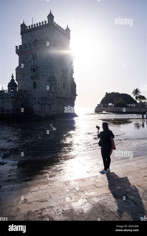 Idyllic Evening Sunshine Belem Tower Tourists At The Torre De Belém
