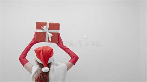 The Video Shows A Jubilant Woman Holding Beautifully Wrapped T On