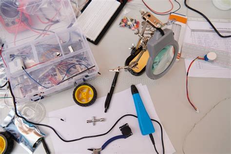 Various Components And Installations For Robot Fabrication Fill The Space Representing The