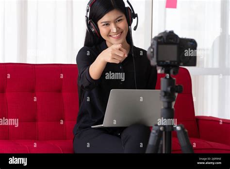 Vlog Asian Woman Blogger Influencer Sitting On The Sofa In Home And