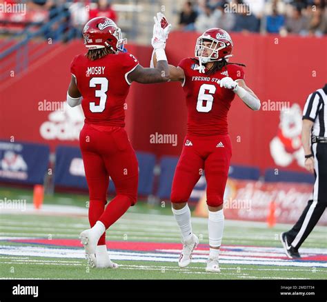 Fresno State Linebacker Levelle Bailey Right High Fives Defensive End