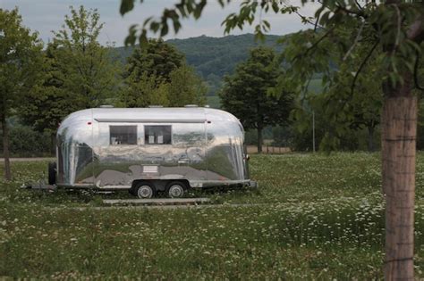 Premium Photo Vintage Airstream Caravan In A Green Park